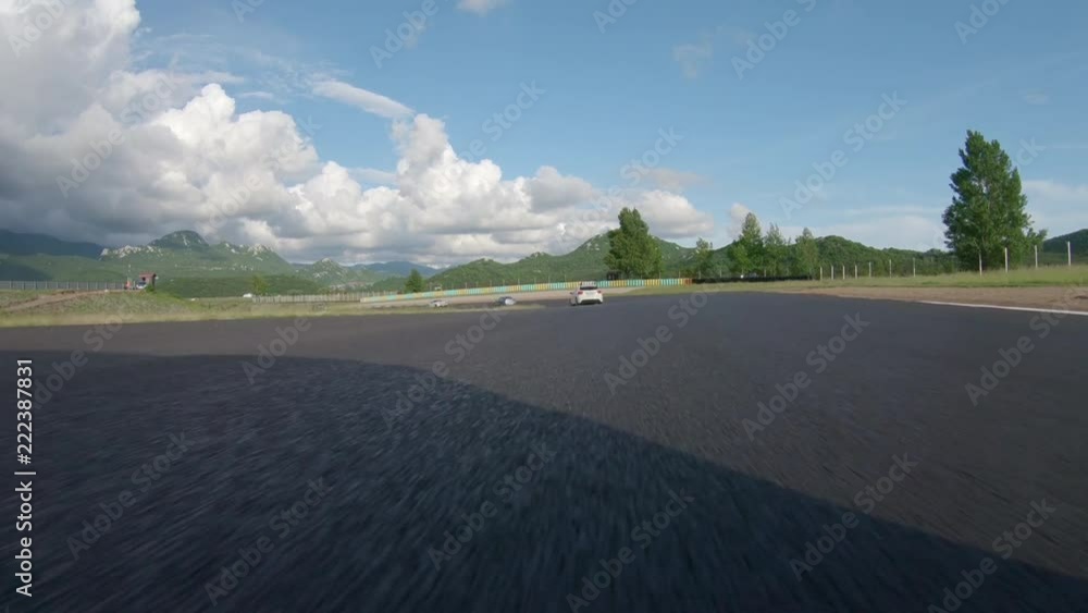 Stockvideo POV: Speeding through the curves of a cool asphalt racetrack ...
