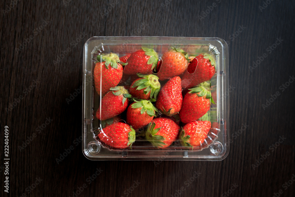 Strawberries in plastic container Stock Photo | Adobe Stock