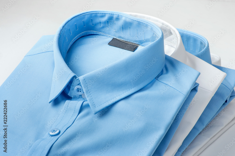 Stack of blue and white shirt Stock Photo | Adobe Stock