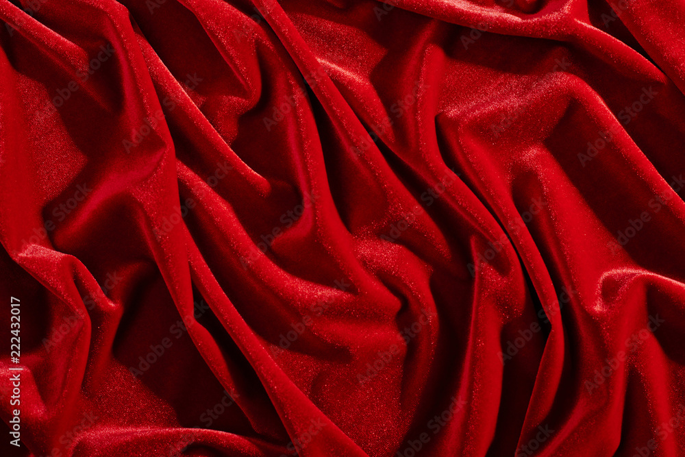 Red color velvet textiles for background or texture, wrinkled and ...