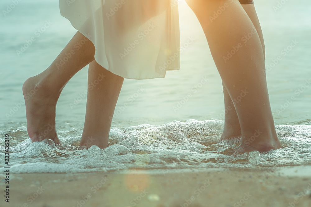 A loving couple on vacation. girl standing on tiptoes for a kiss ...