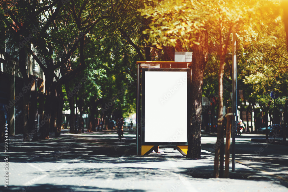 Vertical empty billboard placeholder template on the city bus stop with ...