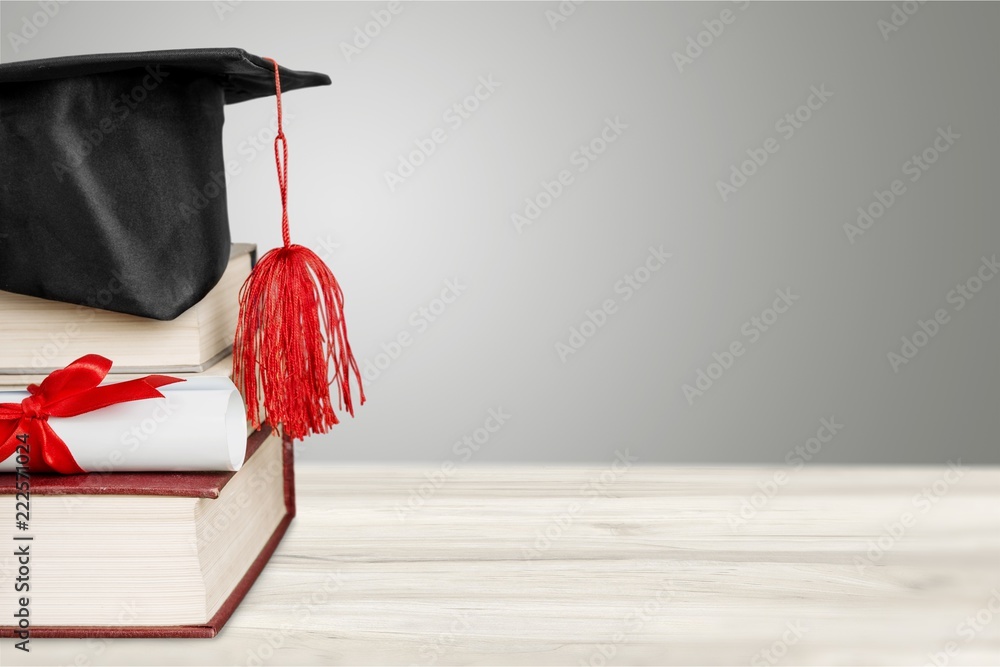 Graduation cap with books and Degree Stock Photo | Adobe Stock
