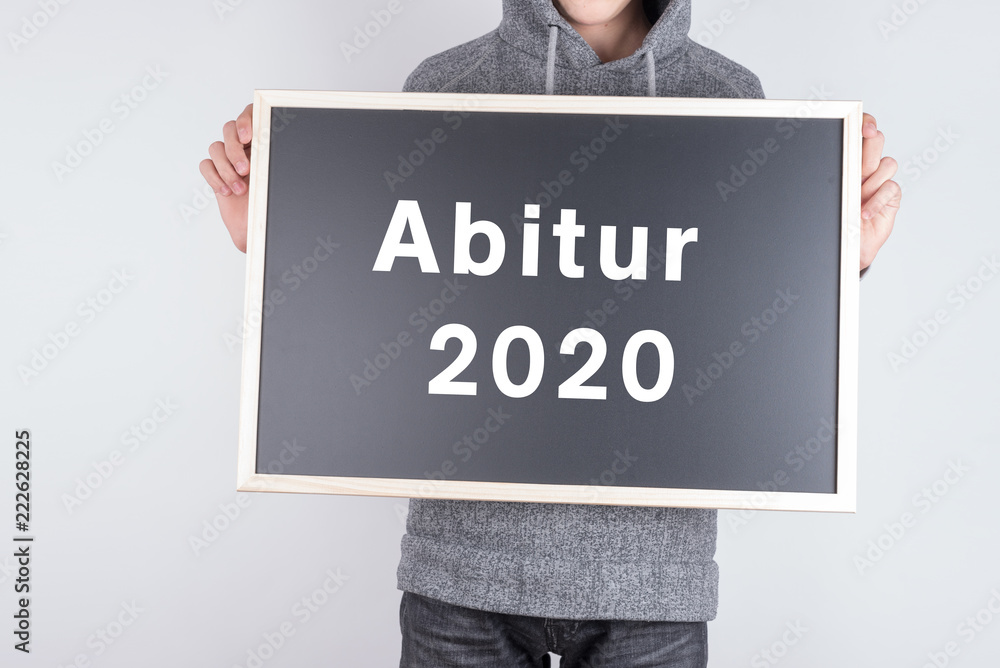 Schüler mit einem Schild Abitur 2020 Stock Photo | Adobe Stock