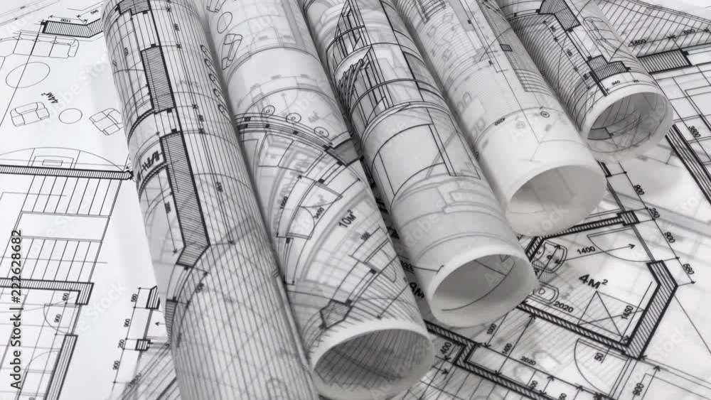 Blueprints - rolls of architectural drawings smoothly rotate on the ...