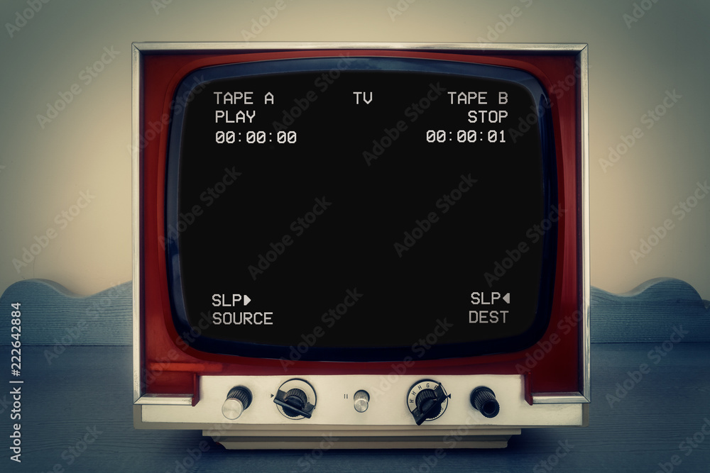 A retro vintage TV showing a clean black VHS tape screen tracking a ...