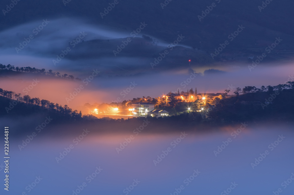 Long exposure with magic of the fog cover town and light at night ...