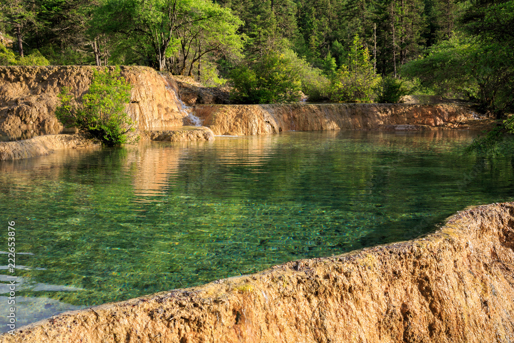 Pools of colorful blue water in Huanglong Scenic Area in Sichuan ...