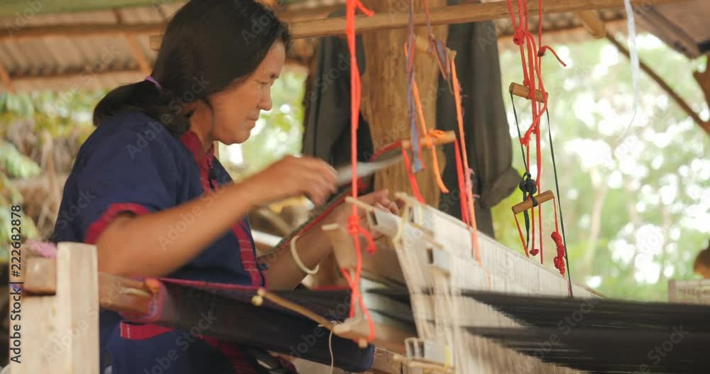 Traditional textile manufacture in craft village where old women work ...