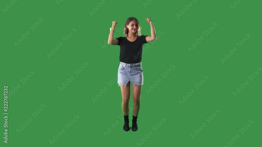 Young stylish pretty woman flexing biceps arm muscles. Girl power ...