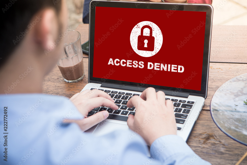 Protection security system concept. Man working on laptop with access ...