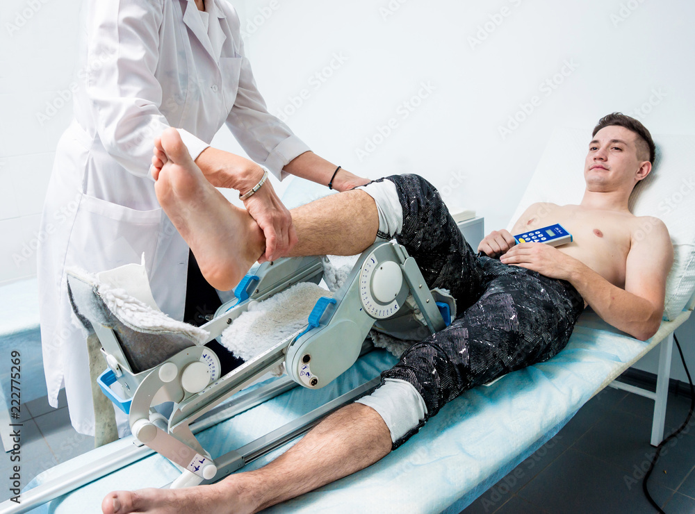 Patient on CPM (continuous passive range of motion) machines. Stock ...