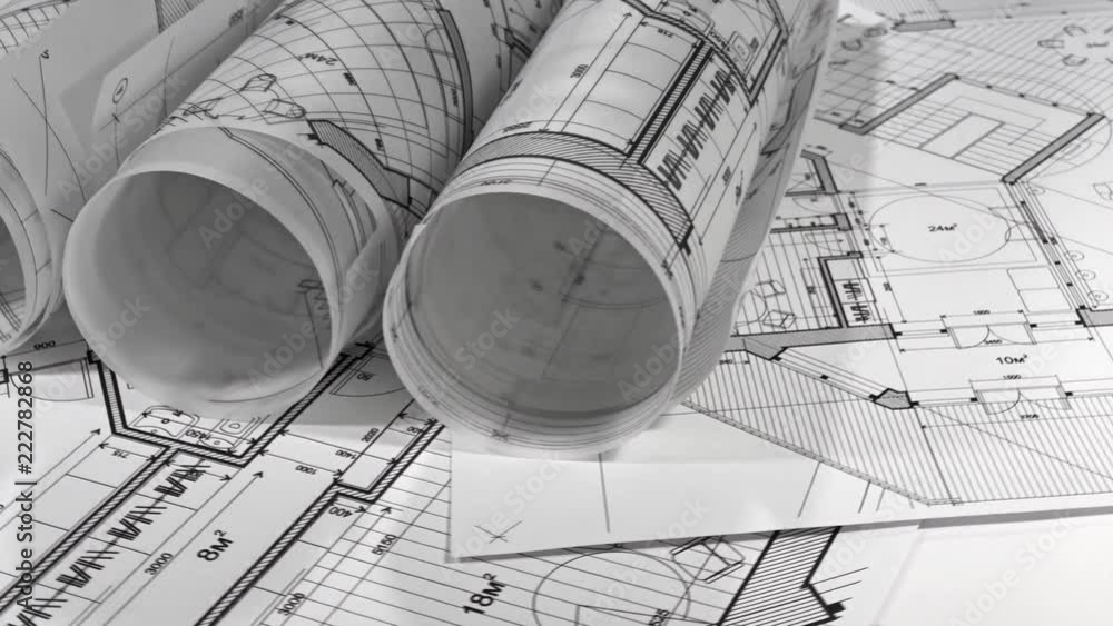 Blueprints - rolls of architectural drawings smoothly rotate on the ...