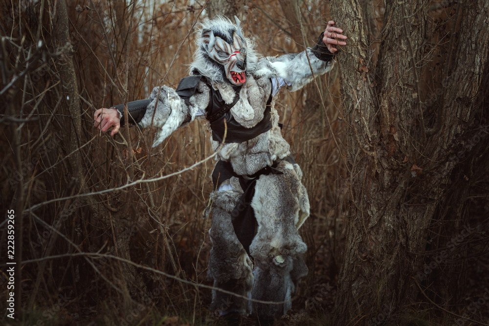 Terrible creature resembling a human wolf in the forest. Stock Photo ...