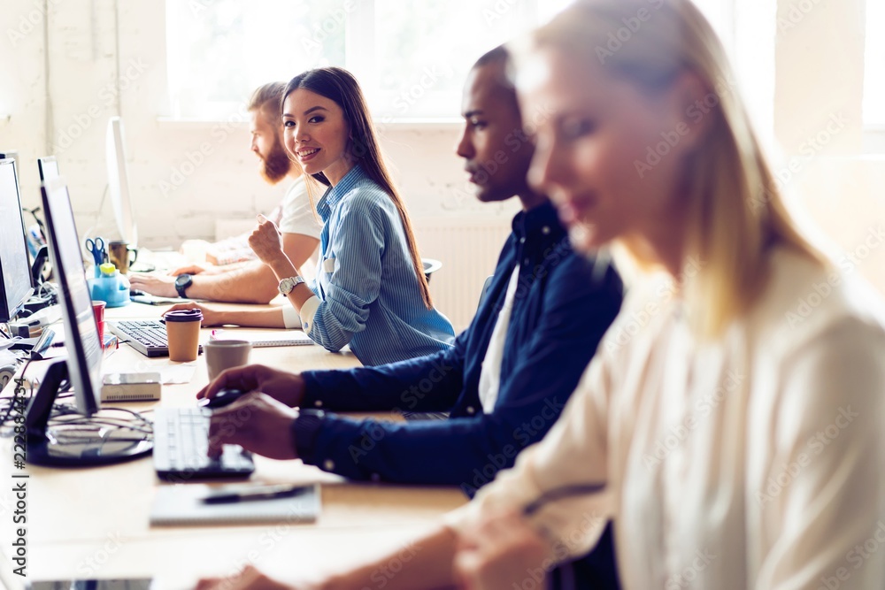 Confident and successful. Young modern colleagues in smart casual wear ...