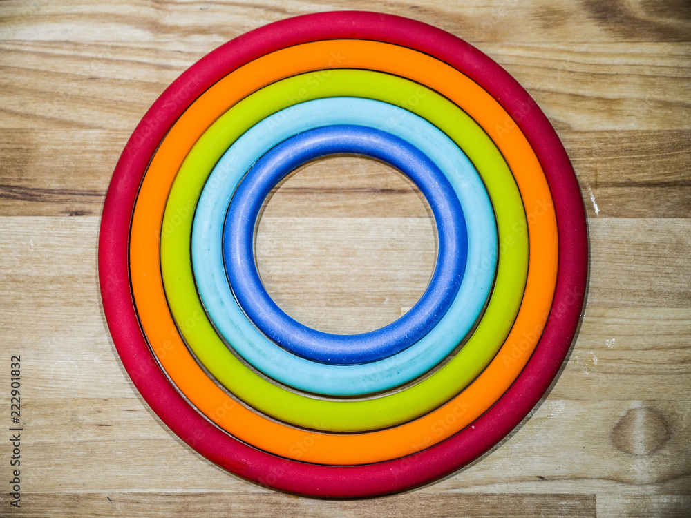 Beautiful abstract photograph of colorful circular ring shaped flexible ...