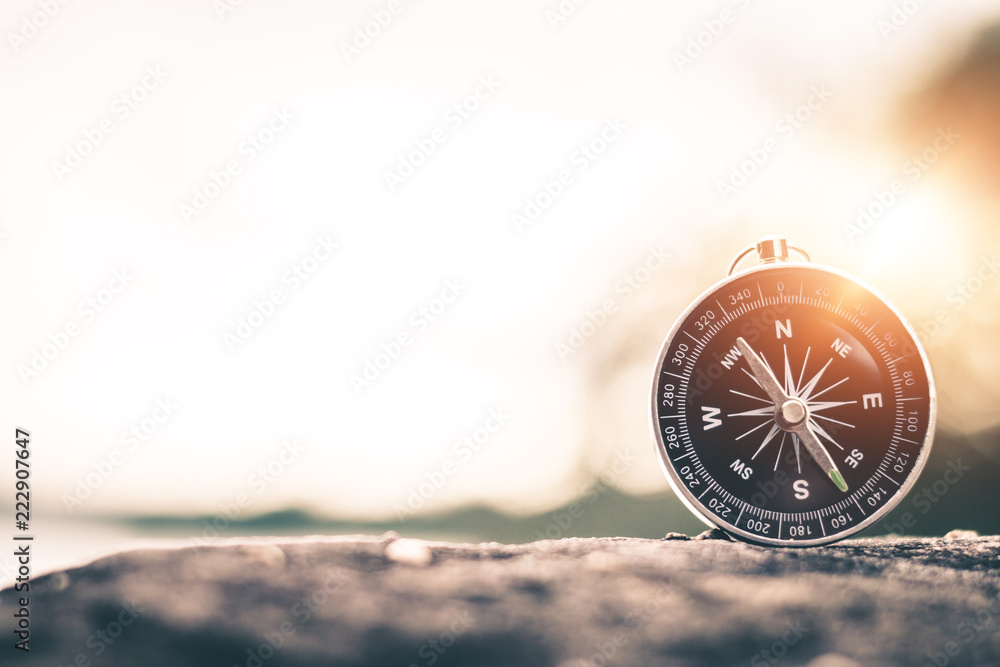 Compass of tourists on mountain at sunset sky. Stock Photo | Adobe Stock
