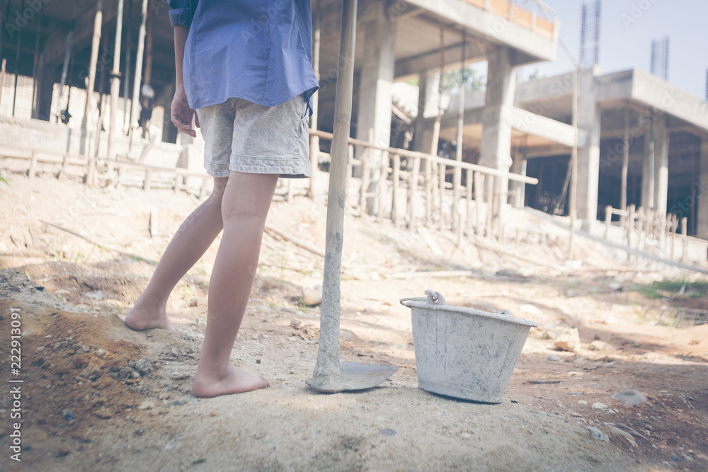 Little girl labor working in commercial building structure, World Day ...