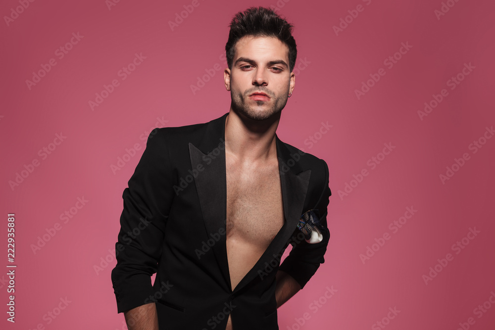 portrait of arrogant sexy man wearing only a black tuxedo Stock Photo ...