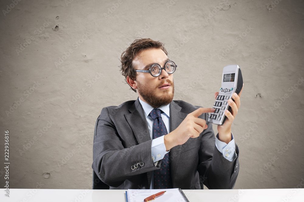 Nerd accountant does calculation of company revenue Stock-Foto | Adobe ...