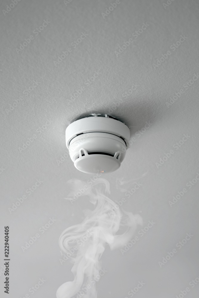 Smoke detector of fire alarm in action Stock Photo | Adobe Stock
