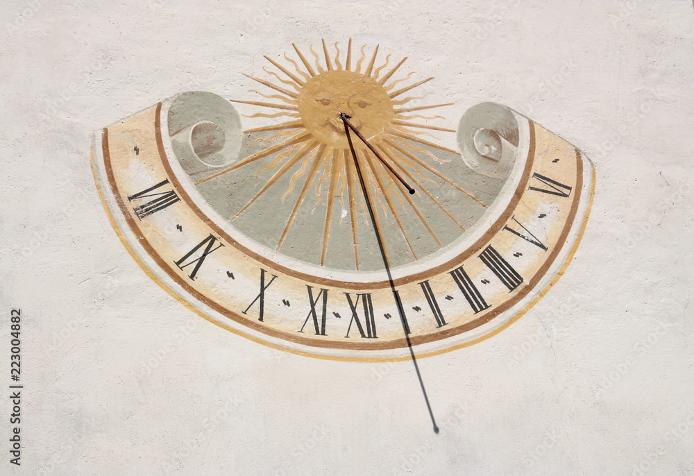 Vertical sundial on a building facade Stock Photo | Adobe Stock