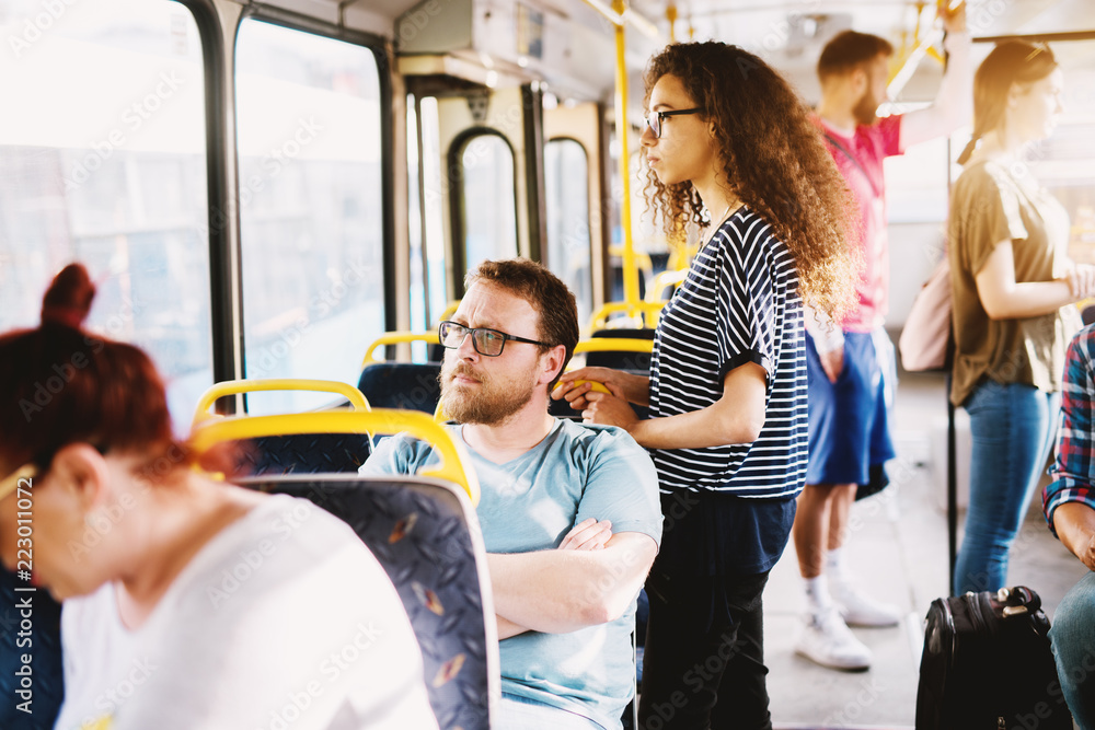 Side view of a people in a bus all waiting for bus to move on to the ...