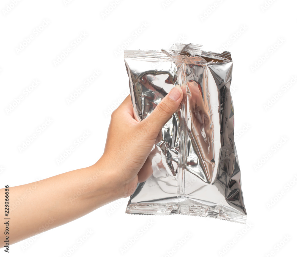 hand holding plastic bag snack packaging isolated on white background ...