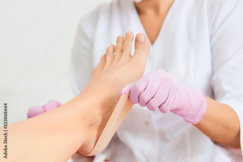 Patient on medical pedicure procedure visiting podiatrist.Podologic ...
