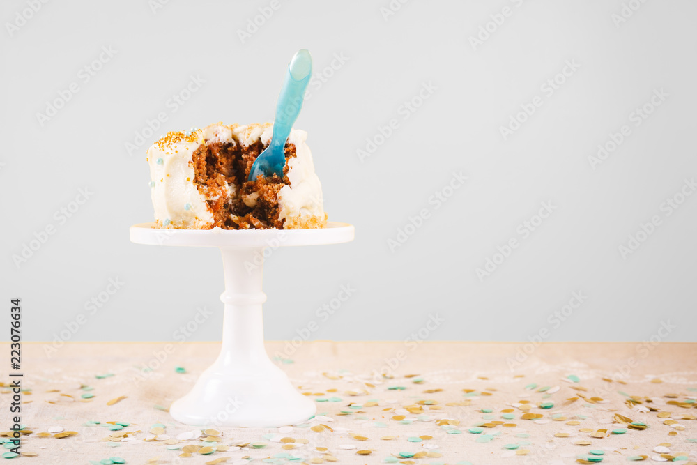 Damaged birthday cake with spoon. Birthday party celebration and ...