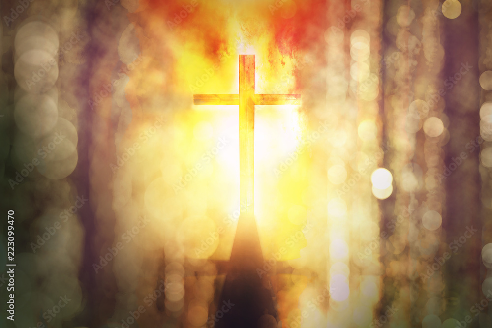 silhouette of burning cross with rays of sunlight background Stock ...