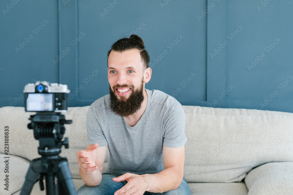 social media influencer creating content. man shooting video of himself ...