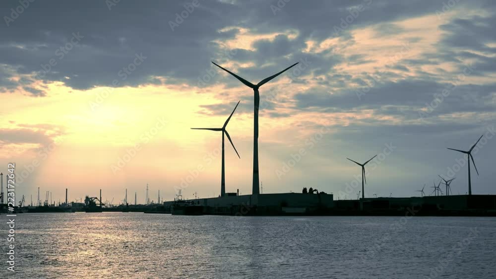 Video „Futuristic view of rotating turbines of wind farm, warehouse ...