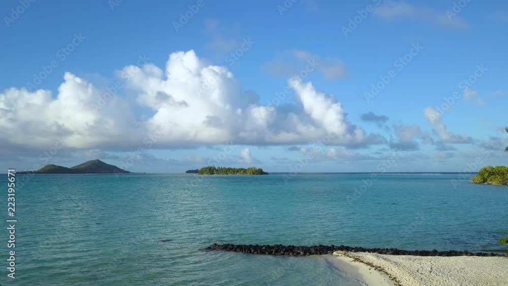Aerial footage from a drone of blue lagoon and Motu Ahuna at Bora Bora ...