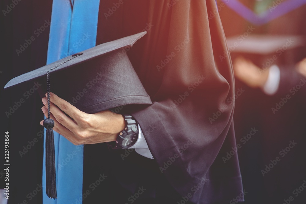 graduation,Student hold hats in hand during commencement success ...
