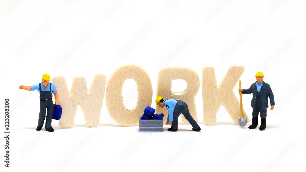 Work word wooden letters and worker models on white background. Blue ...