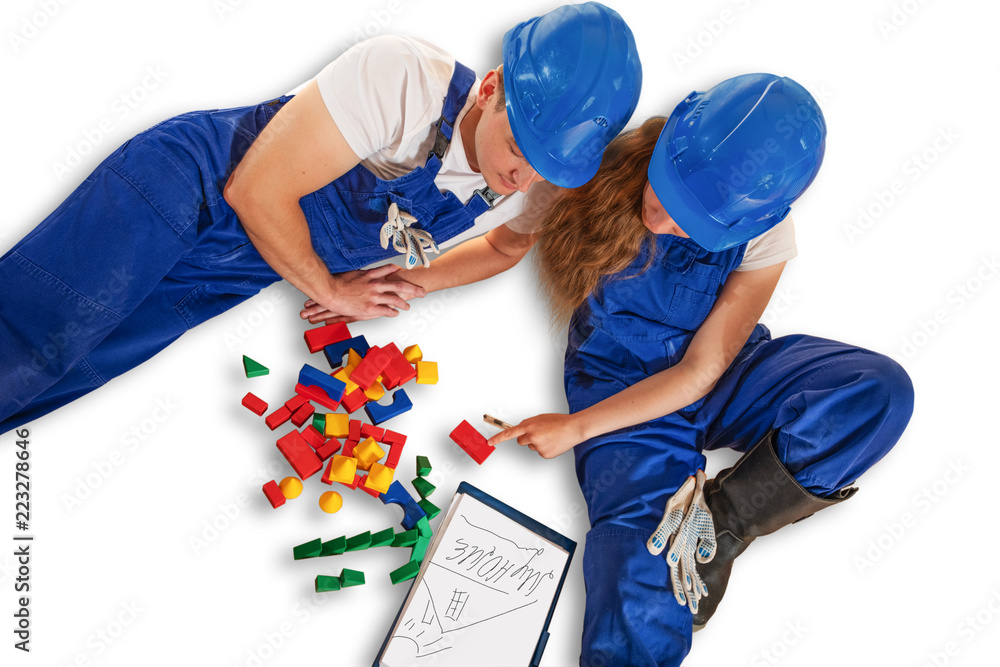 A young couple plans to build a house. Young couple with baby cubes ...
