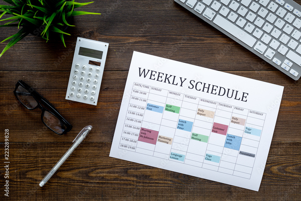 Weekly schedule. Planning the week. Multicolored planner on manager ...