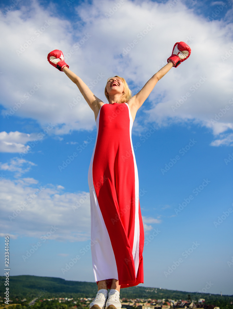 Woman red dress and boxing gloves enjoy victory. She fighter female ...