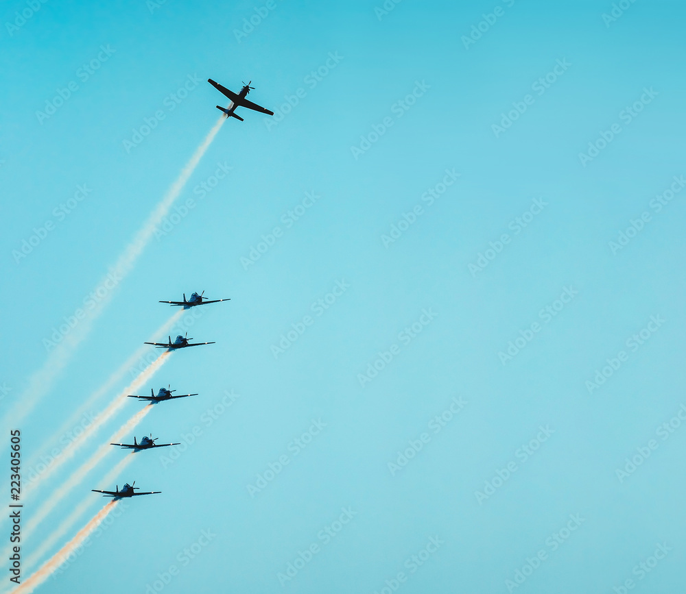 Airplane flying up separating from the squad. Airplanes flying together ...