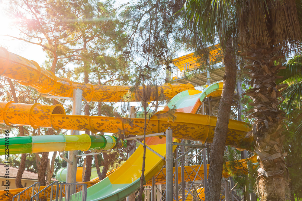 Vicky beautiful multi-colored water slide on the blue sky background ...