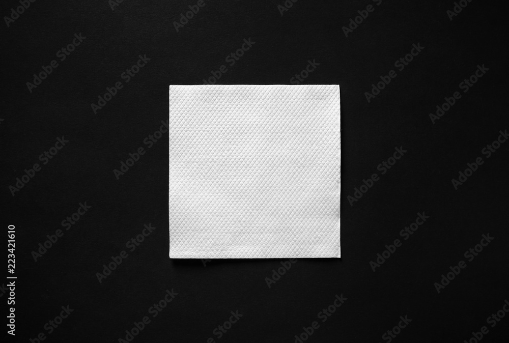 Blank white paper napkin on black background with copy space. Flat lay ...