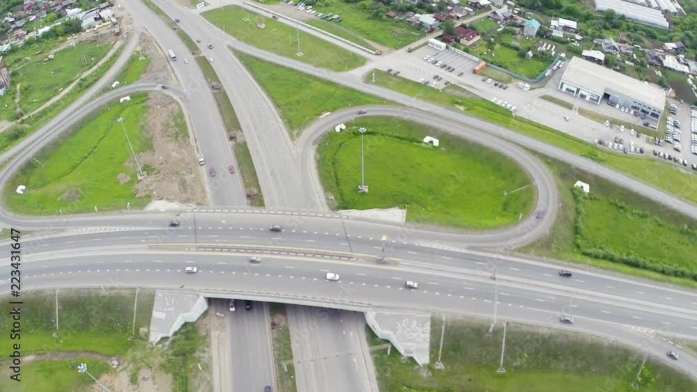 Aerial view of highway in city. Clip. Cars crossing interchange ...