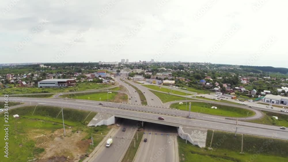 Aerial view of highway in city. Clip. Cars crossing interchange ...
