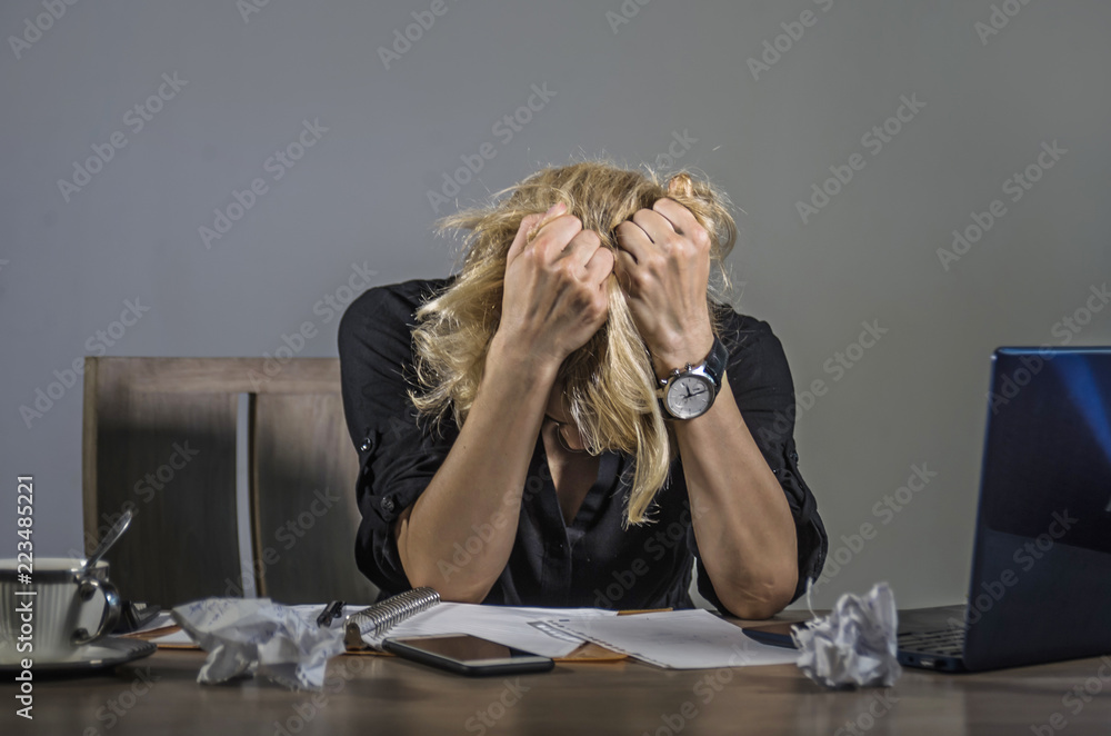 young frustrated and stressed business woman crying sad at office desk ...