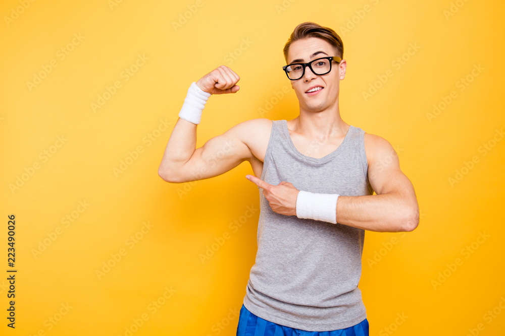 Did you see it Portrait of funny youngster man show biceps on h Stock ...