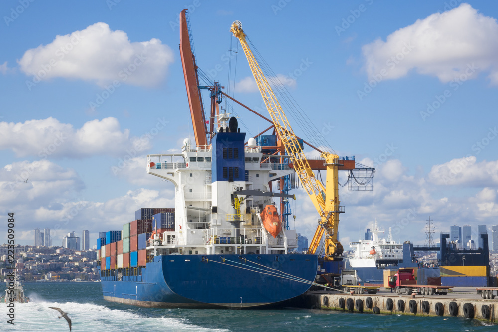 Industrial port crane lift up loading export containers box onboard ...