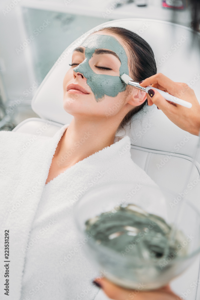 Zdjęcie Stock: partial view of cosmetologist applying clay mask on ...