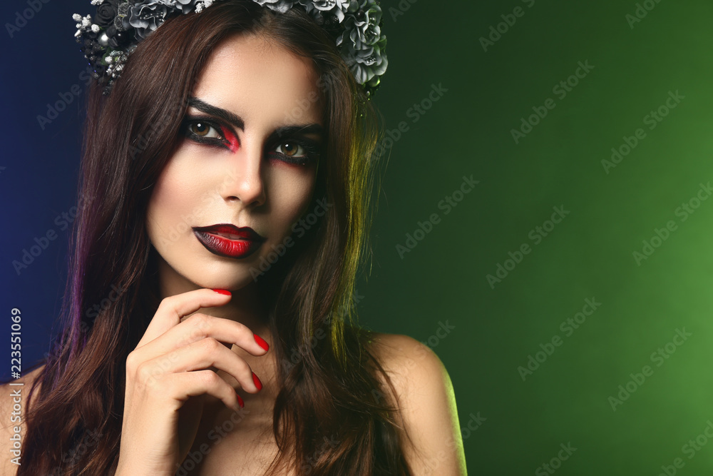 Beautiful woman dressed for Halloween on color background Stock Photo ...