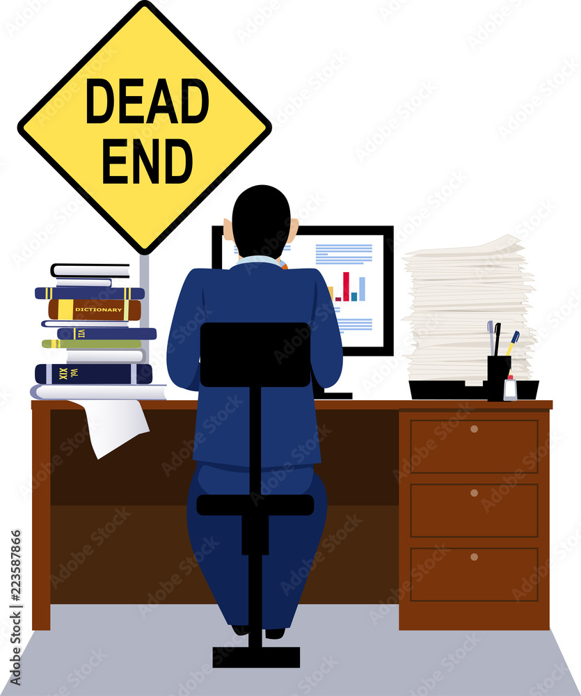 Person working at the desk with a dead end sign above it as a metaphor ...